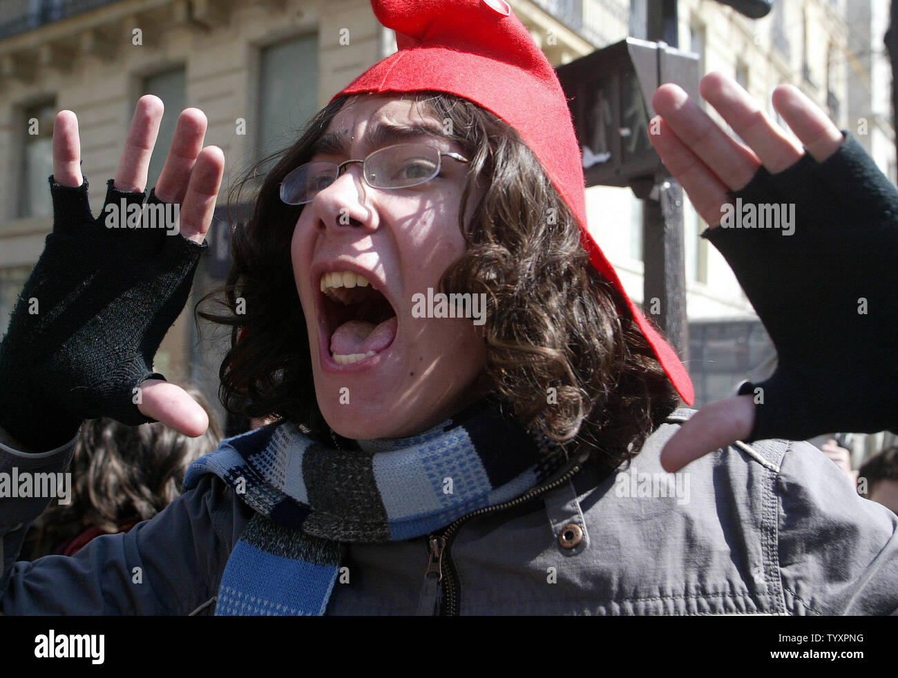 A French student protestor wears the hat of Marianne, symbol of the ...