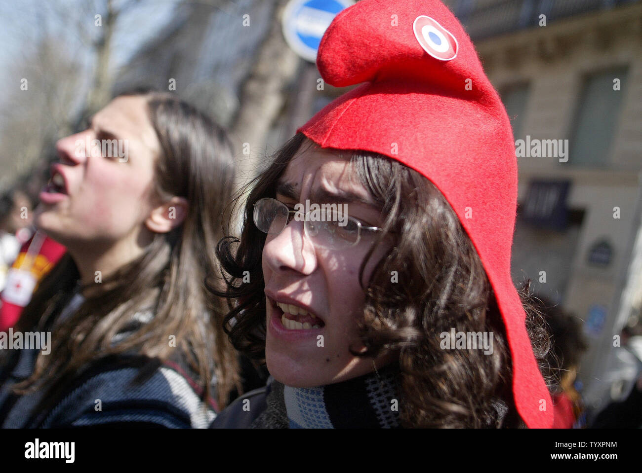 A French student protestor wears the hat of Marianne, symbol of the ...