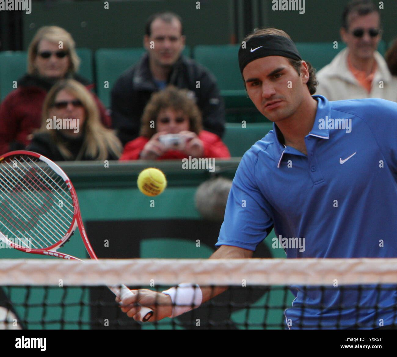 Top-seeded Swiss Roger Federer prepares to volley during his second ...