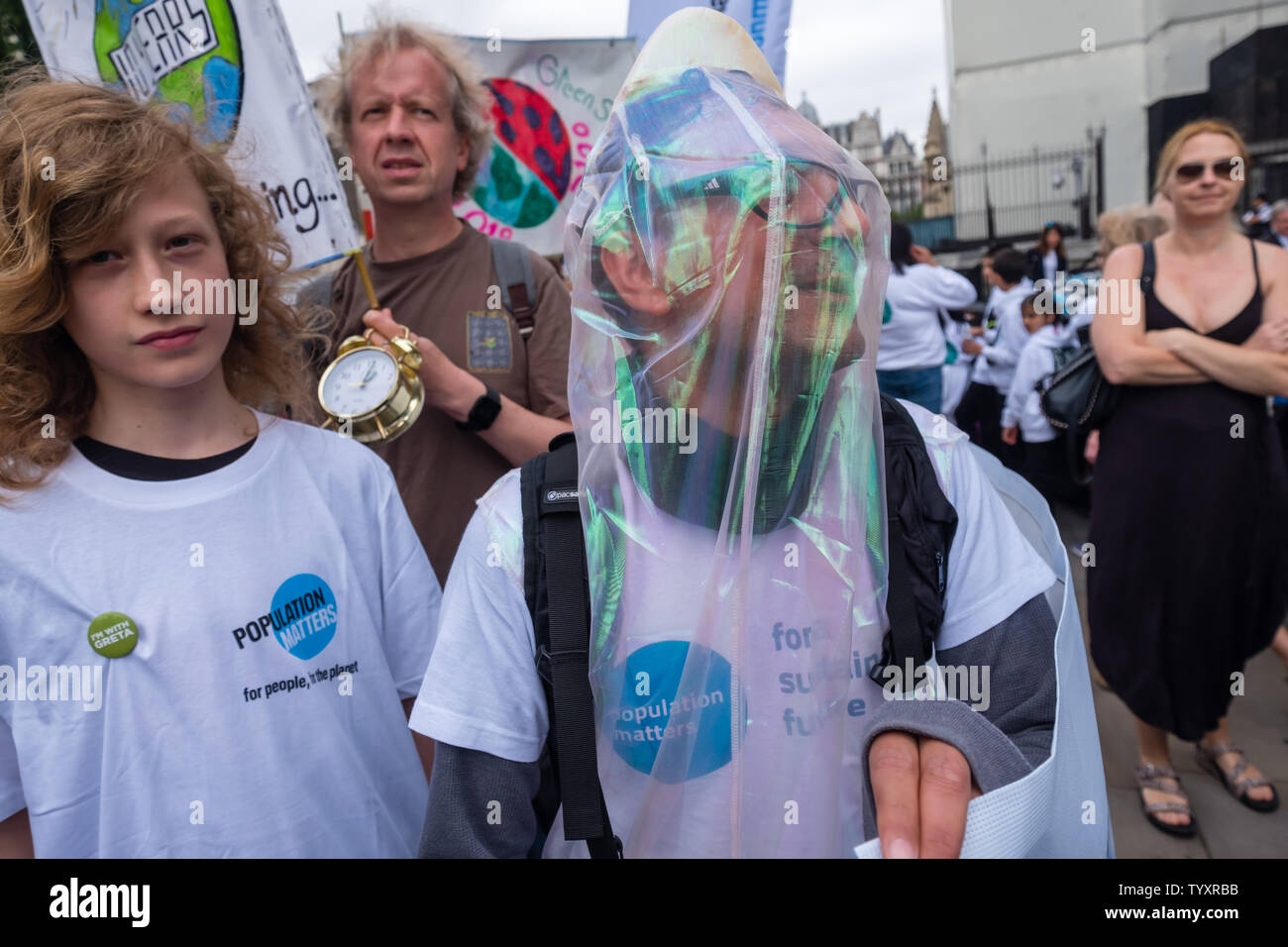London, UK. 26th June 2019. Campaigners from Population Matters march ...