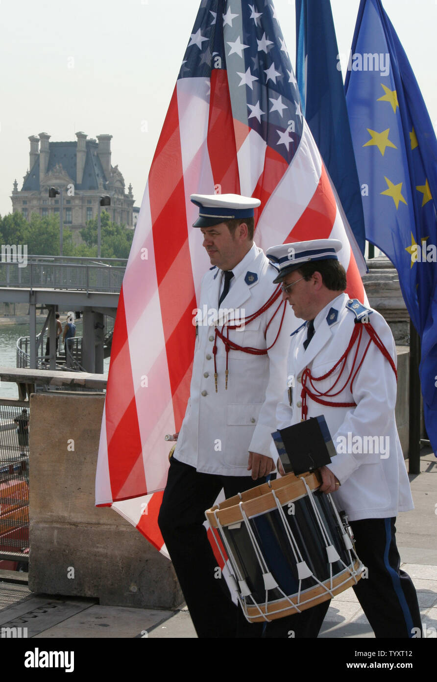 Members of marching band prepare for the start of a 4th of July ...