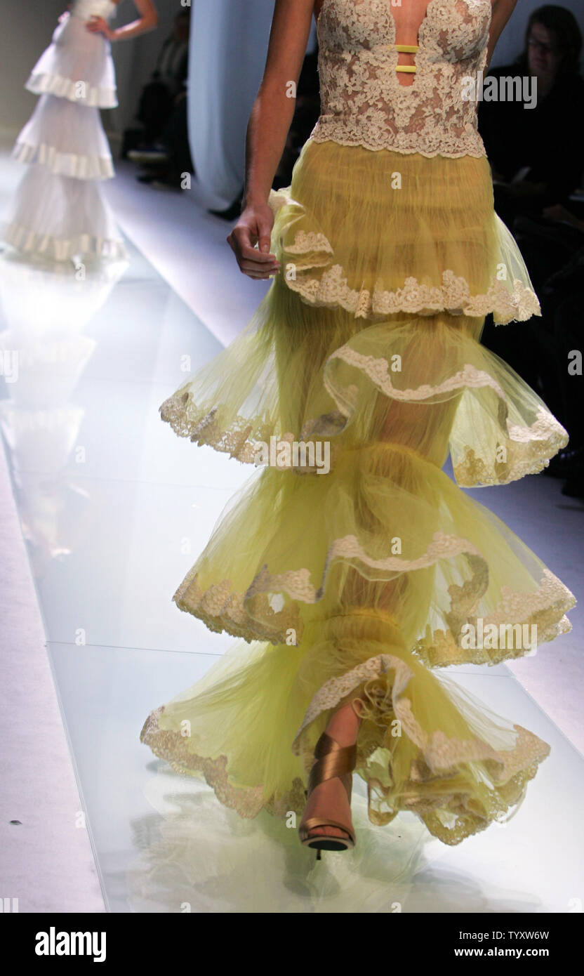 A model takes to the catwalk with an outfit by Italian fashion designer ...