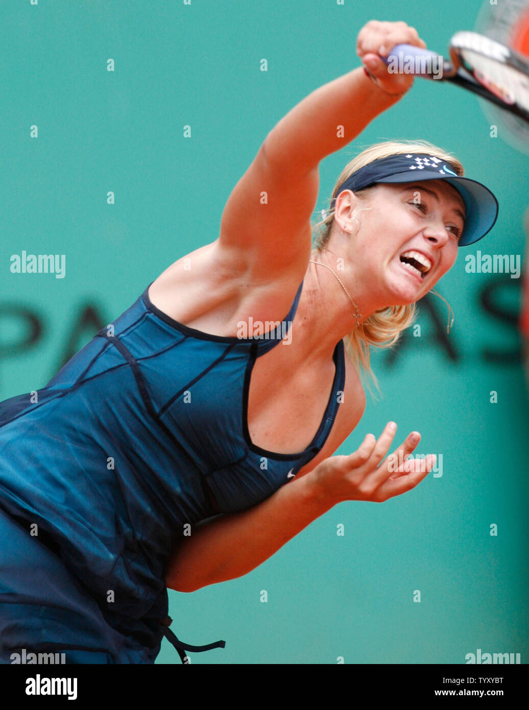 Russian Maria Sharapova hits a serve during her semi-final match ...