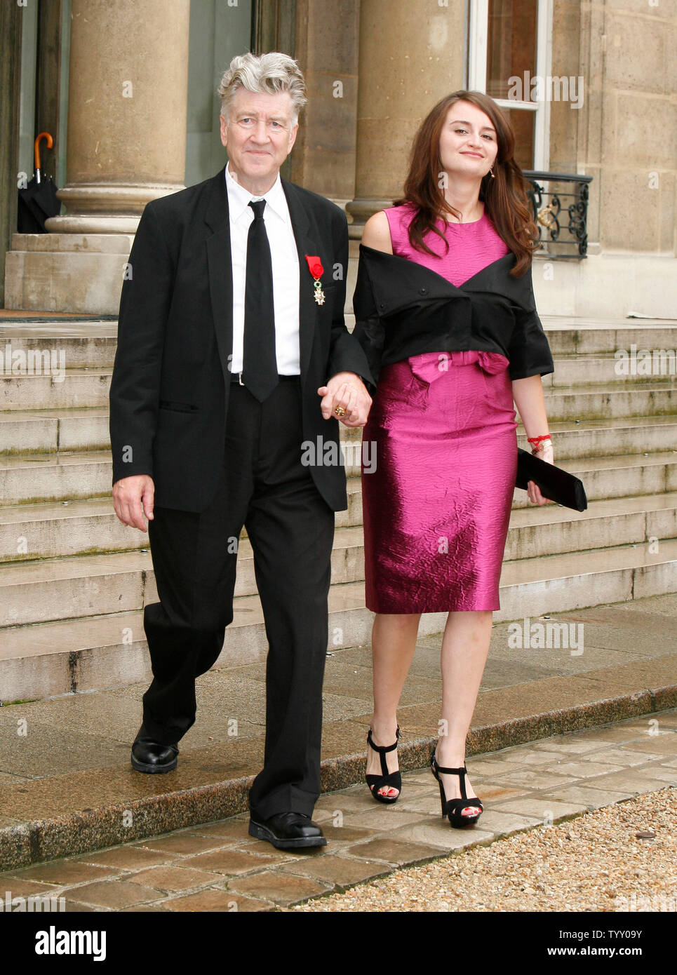 Director David Lynch and actress Emily Stofle leave the Elysee ...