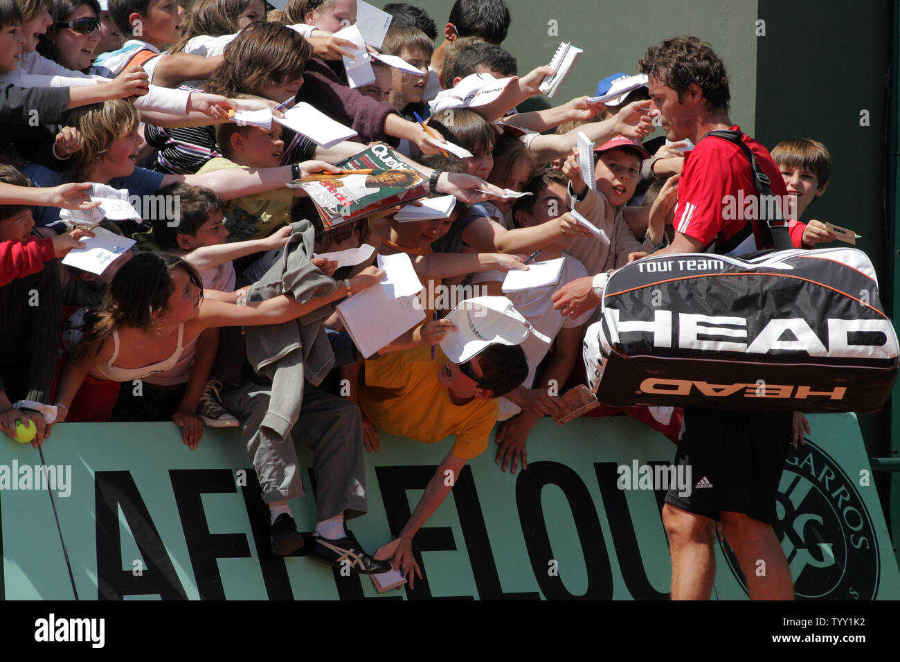 Marat Safin of Russia signs autographs after winning his first round ...