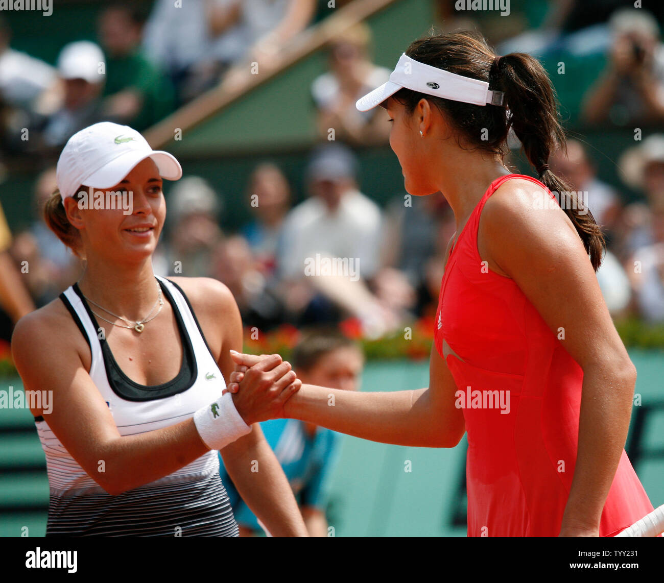 Ana Ivanovic of Serbia (R) shakes hands with her fourth round match ...