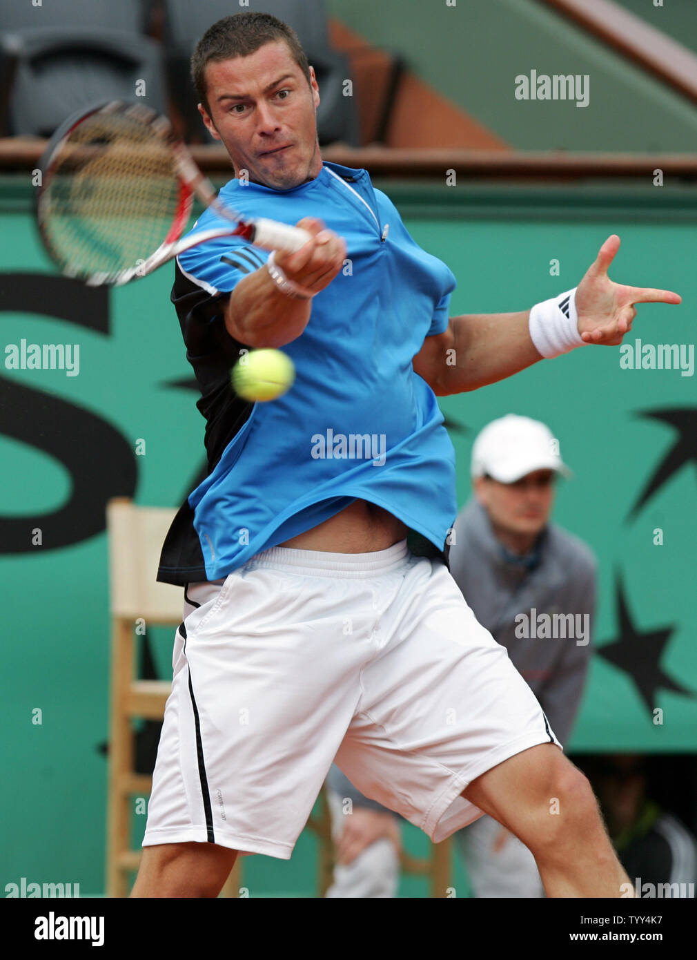 Twentieth seeded Marat Safin of Russia hits a return against Josselin ...