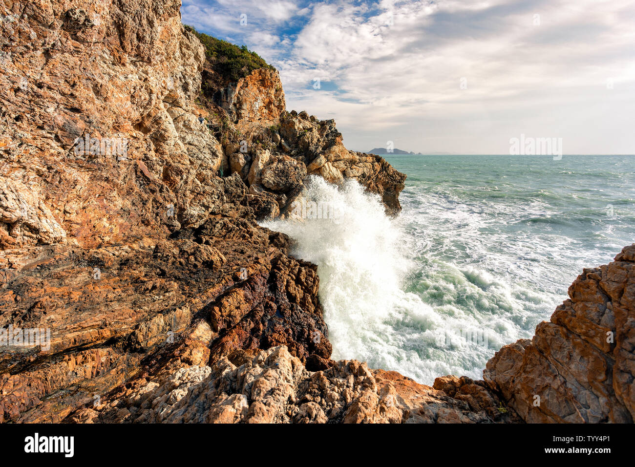 The waves hit the rocks Stock Photo - Alamy