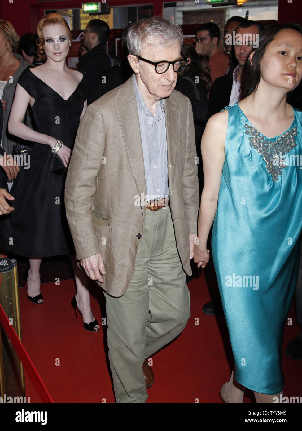 Director Woody Allen and his wife Soon-Yi Previn, followed by actress ...