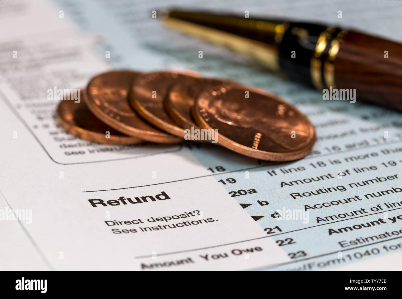 Federal income tax return form with pen and money on document Stock ...