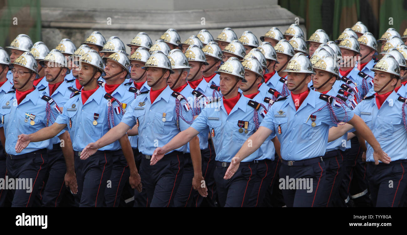 French firefighters march during the annual military parade at the ...