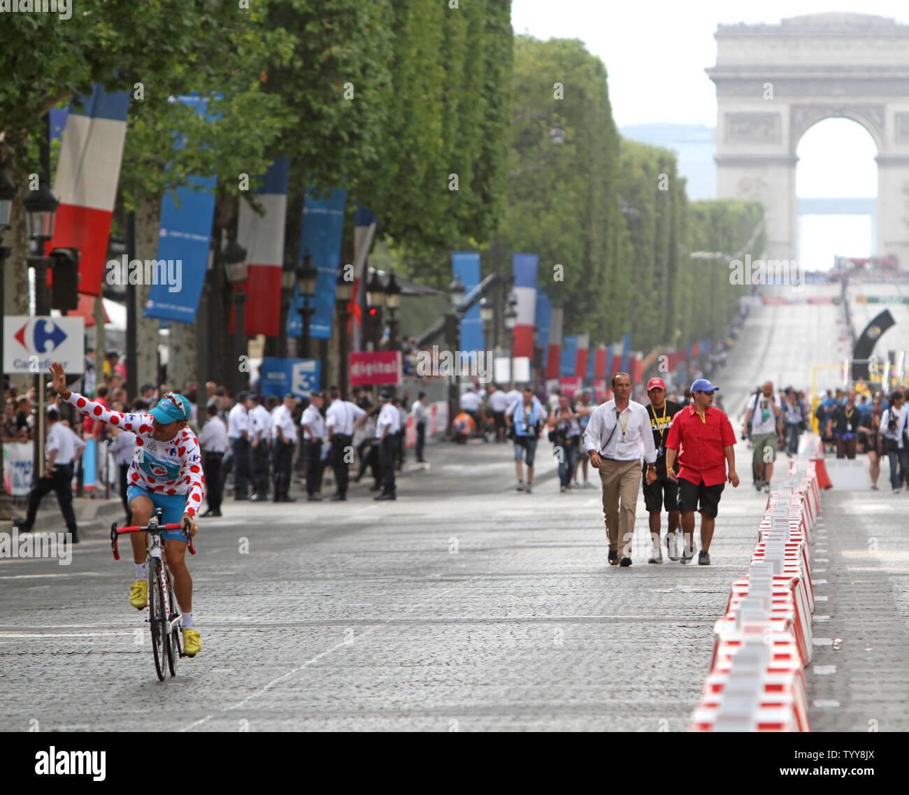 Frenchman Anthony Charteau does a victory lap on the Champs-Elysees ...