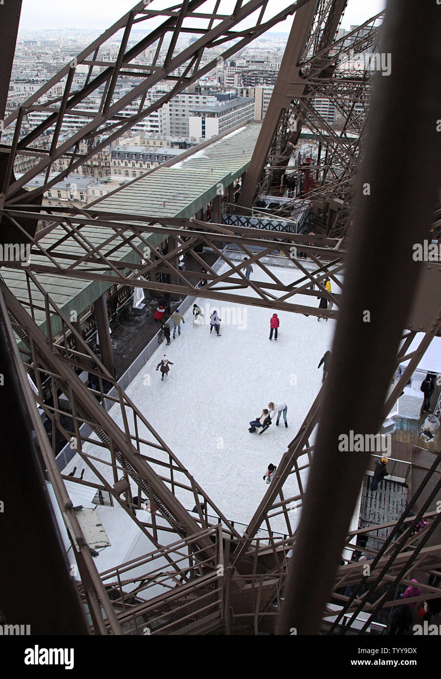 Parisians and visitors ice skate at the opening of a temporary ice rink ...
