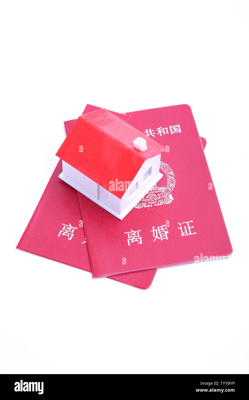 Divorce certificates and house models Stock Photo - Alamy