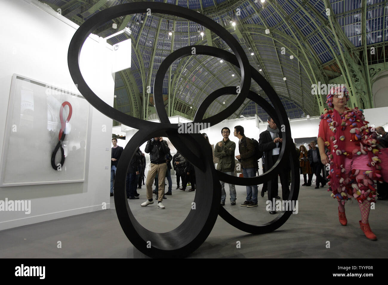Visitors walks past a bronze sculpture entitled "Southern Shade" by ...