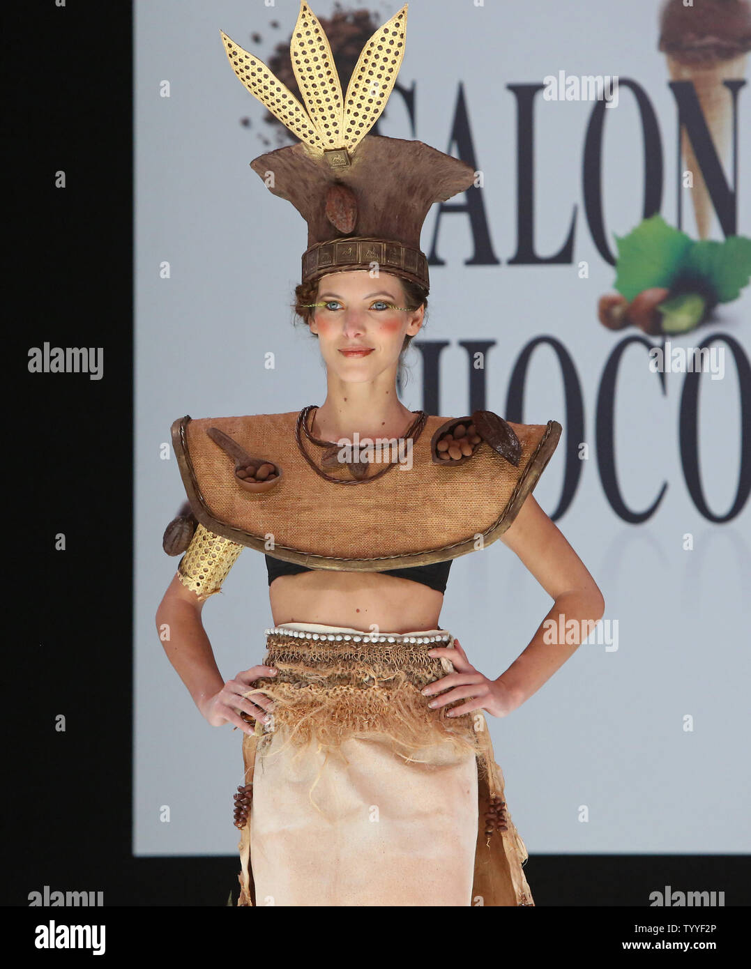 Elodie Varlet wears a creation made with chocolate during a fashion ...