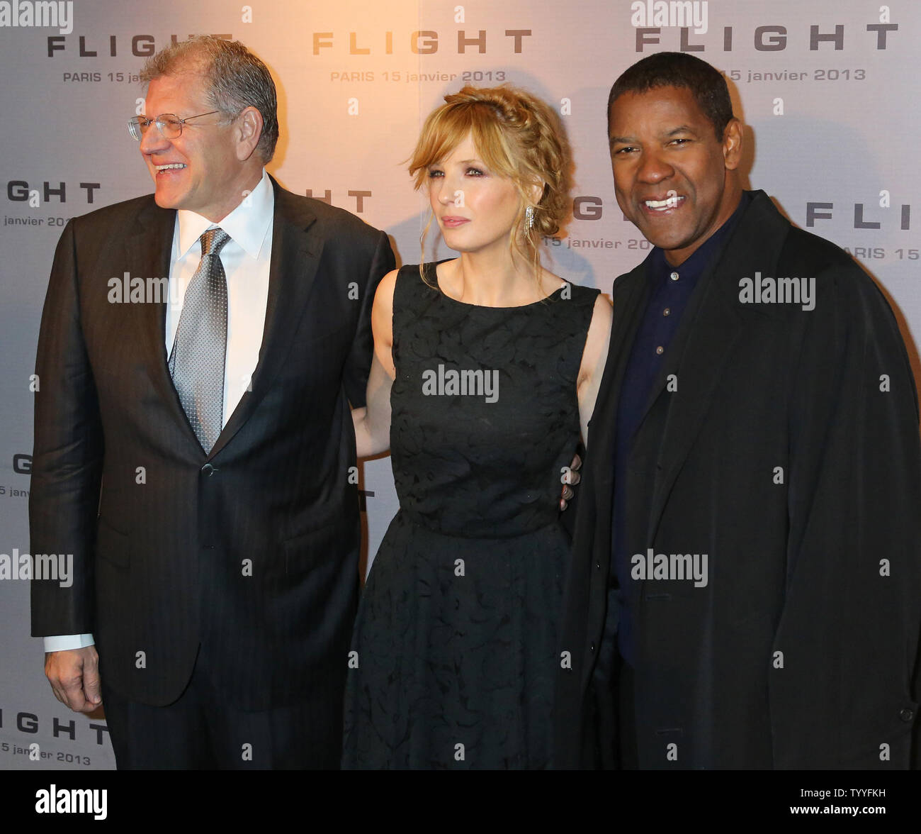 Robert Zemeckis (L), Kelly Reilly (C) and Denzel Washington arrive at ...
