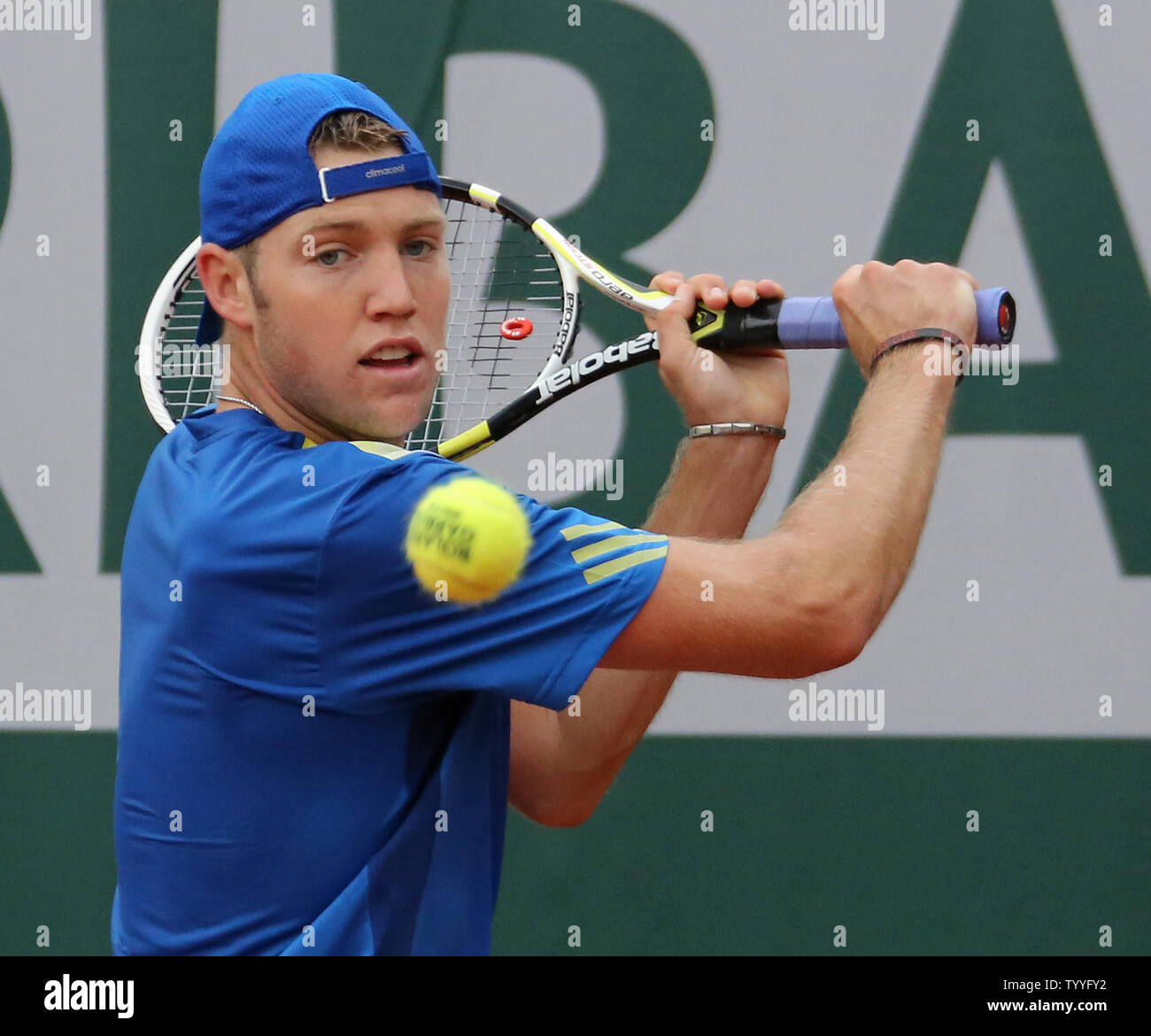 American Jack Sock hits a shot during his French Open men's first round ...