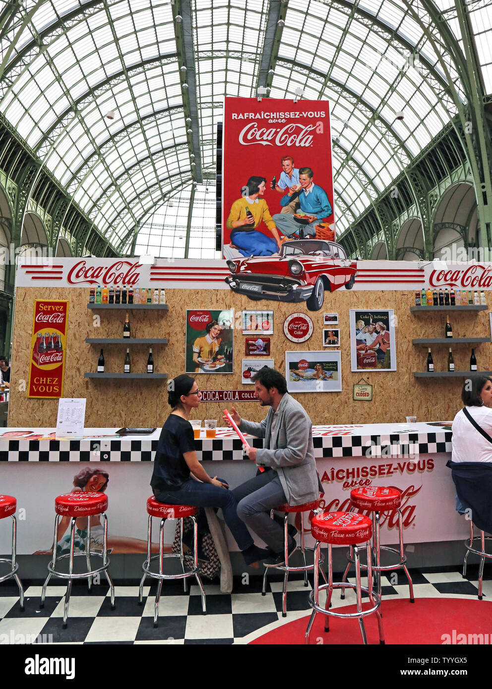 A couple sits at an American-style 1950's diner set up in the Grand ...