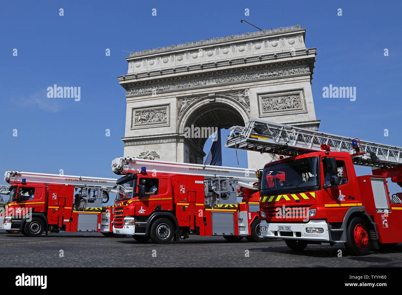 French firefighting vehicles pass the Arc de Triomphe during the annual ...