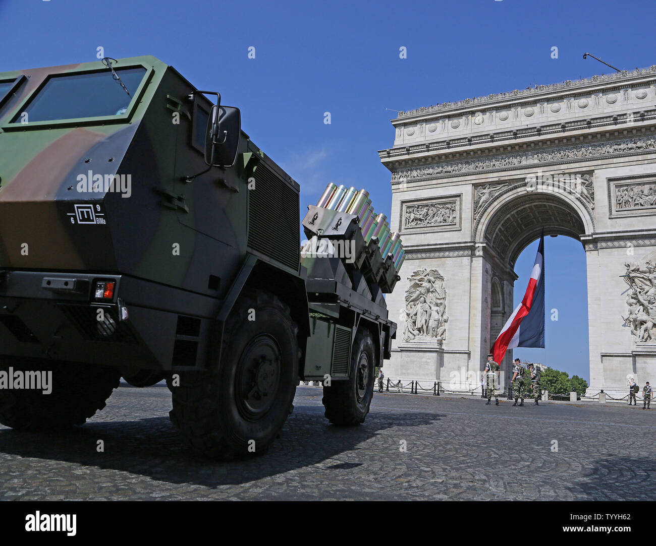 A French military vehicle passes the Arc de Triomphe during the annual ...