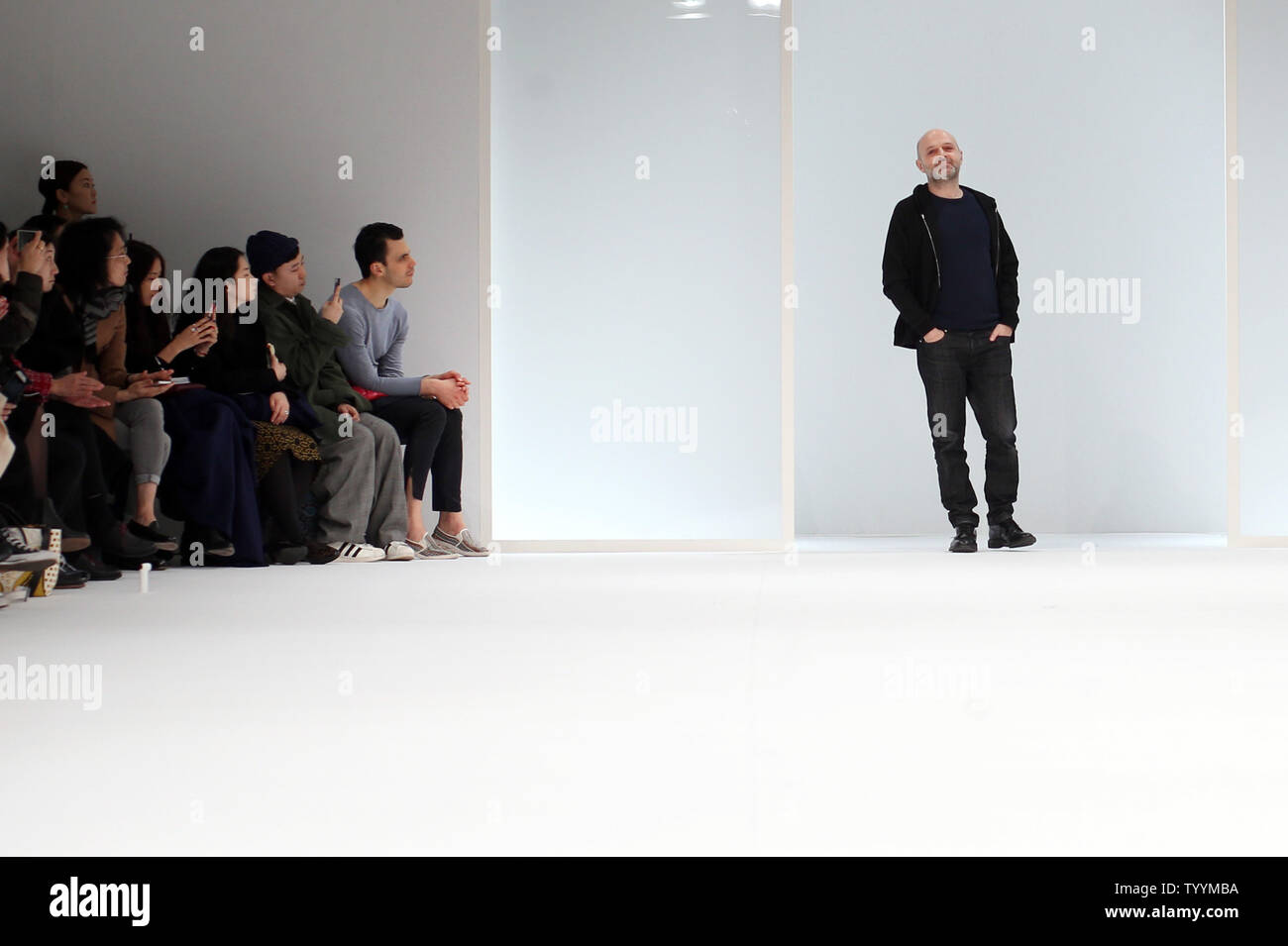 British fashion designer Hussein Chalayan salutes the audience at the ...