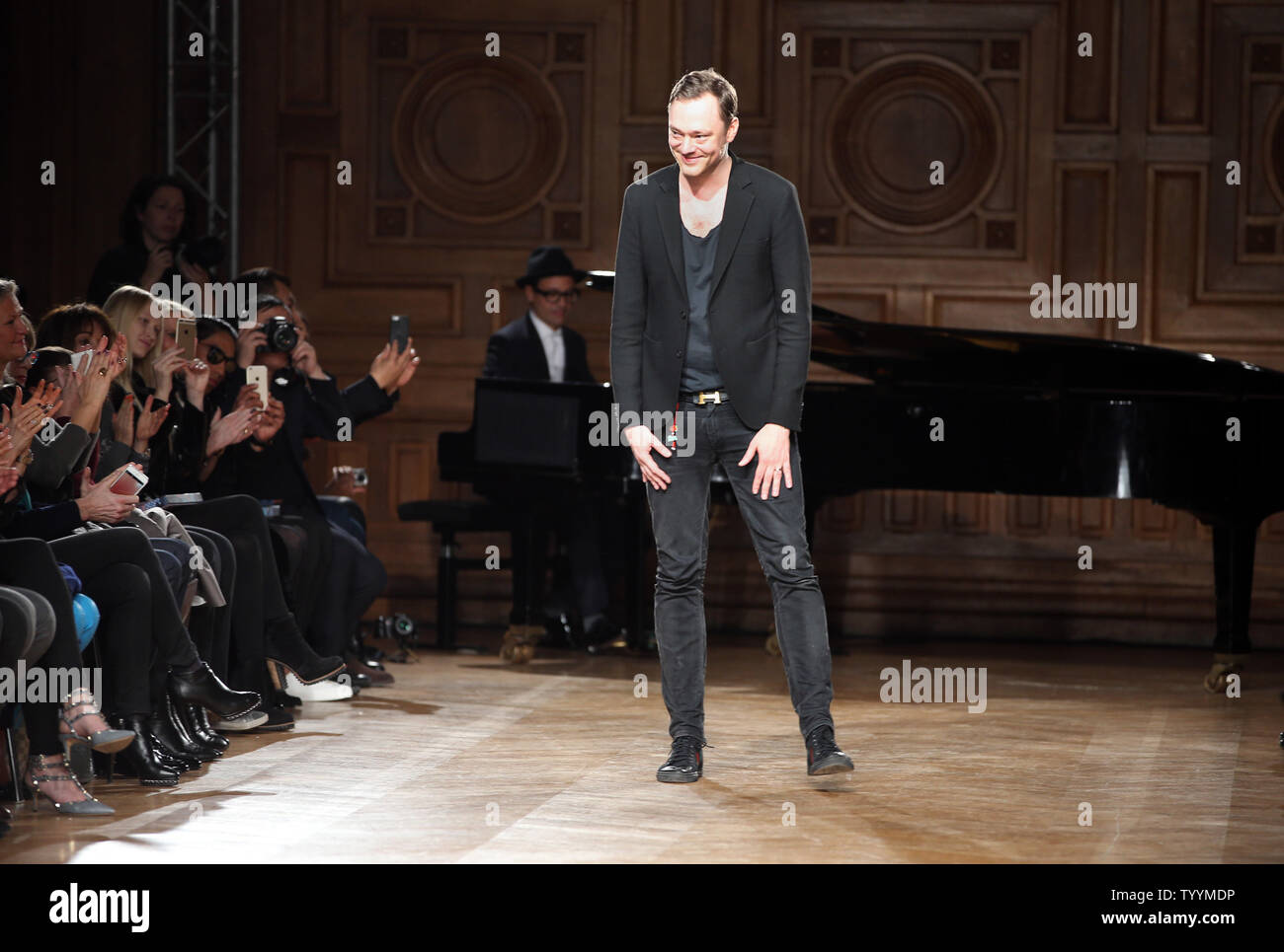 Fashion designer Ole Yde salutes the audience at the end of the ...