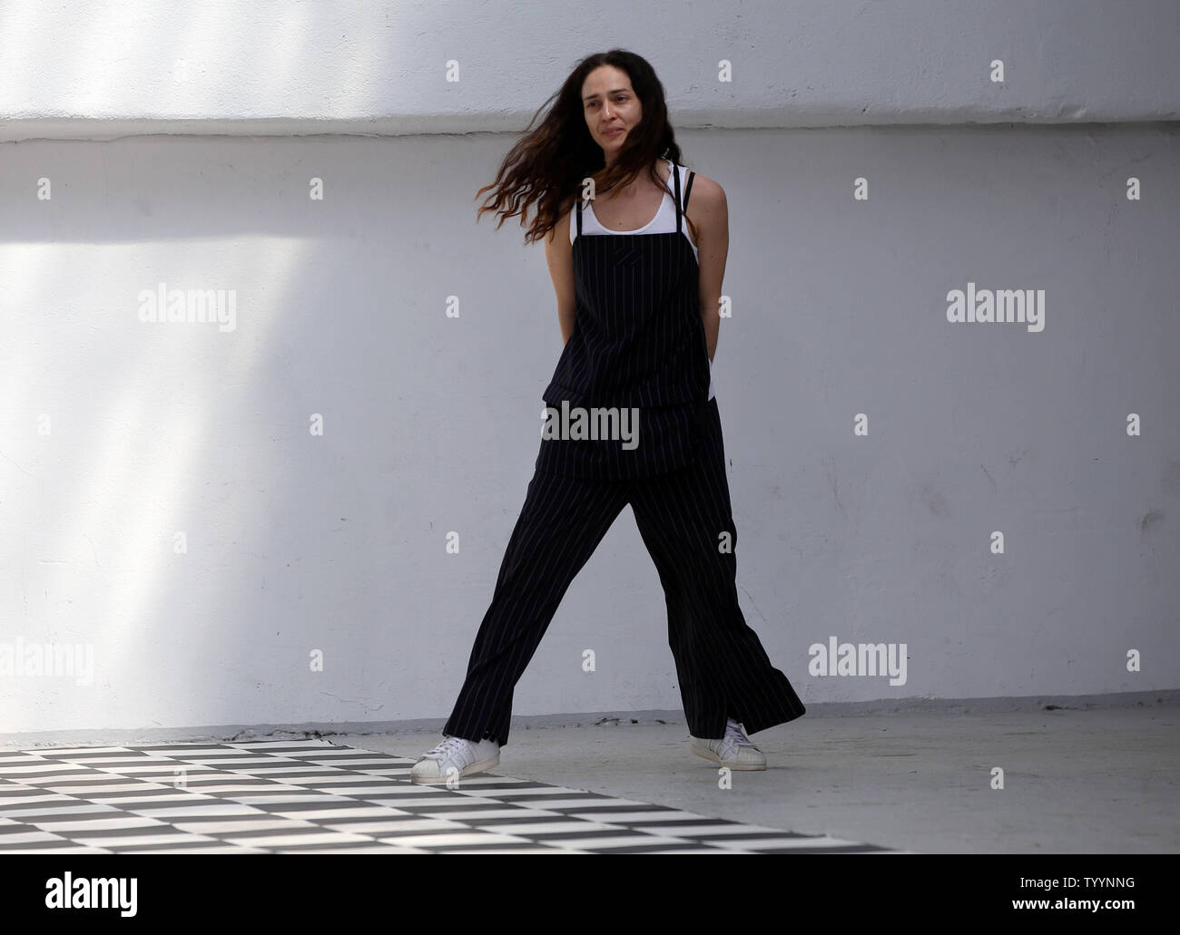 Fashion designer Stephanie Hahn salutes the audience at the end of the ...