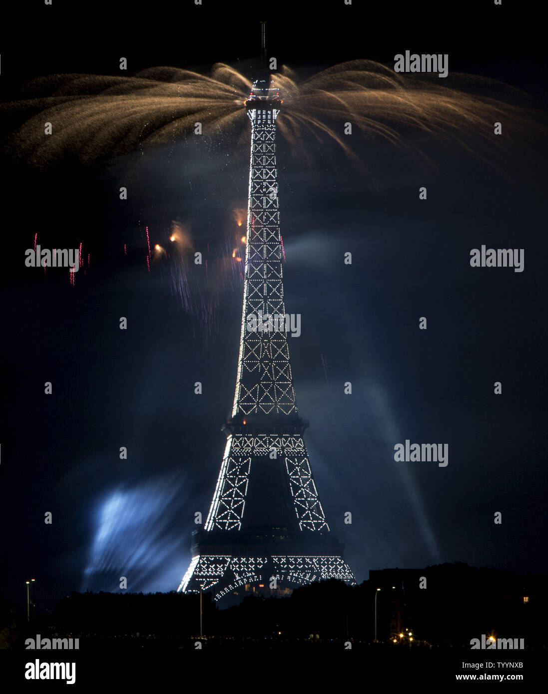 Fireworks explode around the Eiffel Tower during the annual Bastille Day celebration in Paris on ...