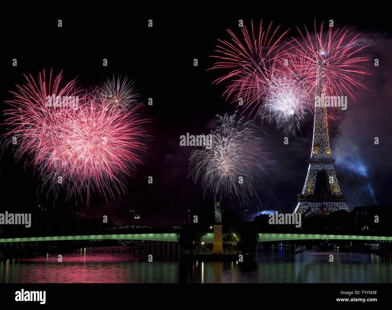 Fireworks explode around the Eiffel Tower during the annual Bastille Day celebration in Paris on ...