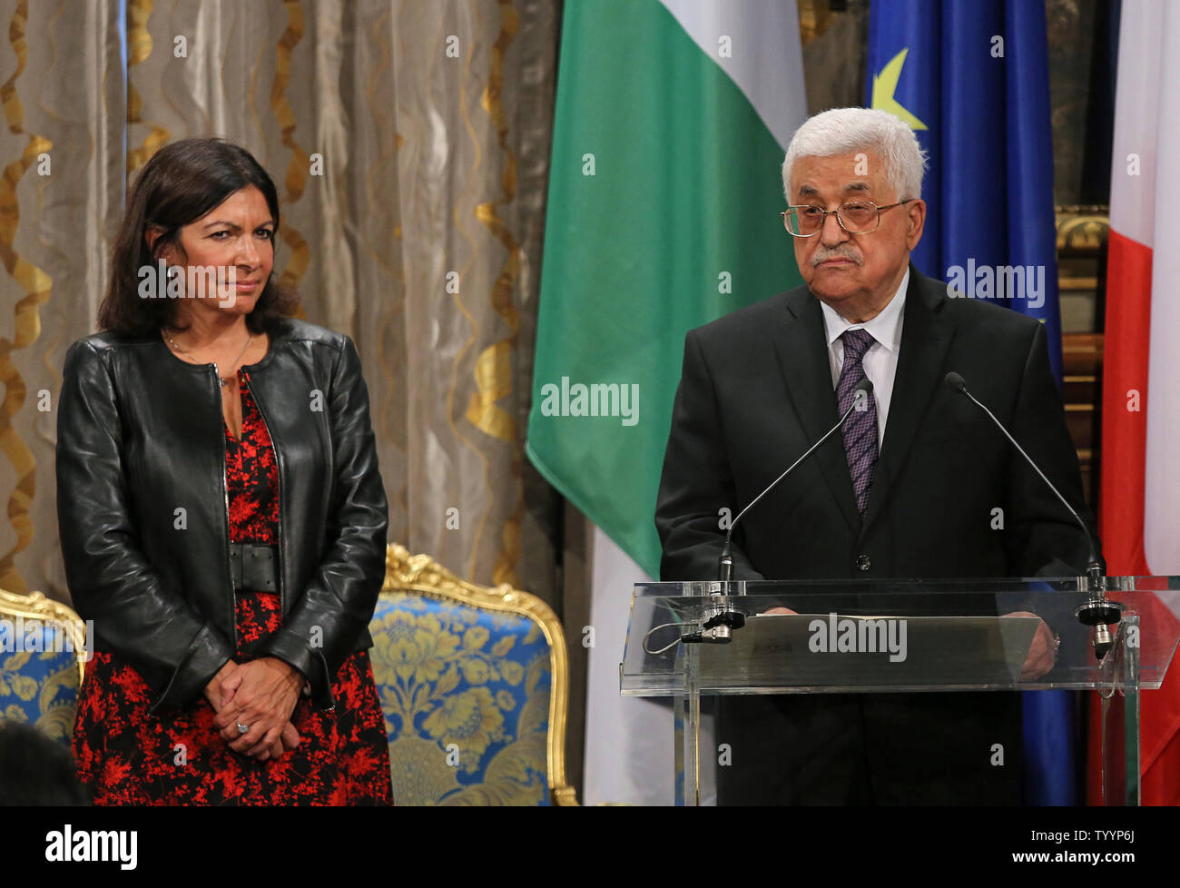 Palestinian President Mahmoud Abbas, with Paris Mayor Anne Hidalgo ...