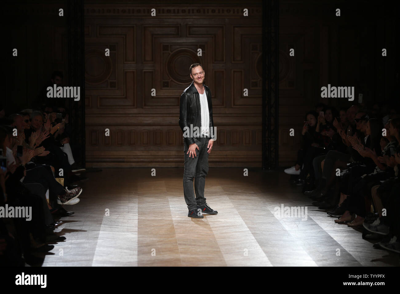 Danish fashion designer Ole Yde acknowledges applause from the audience ...