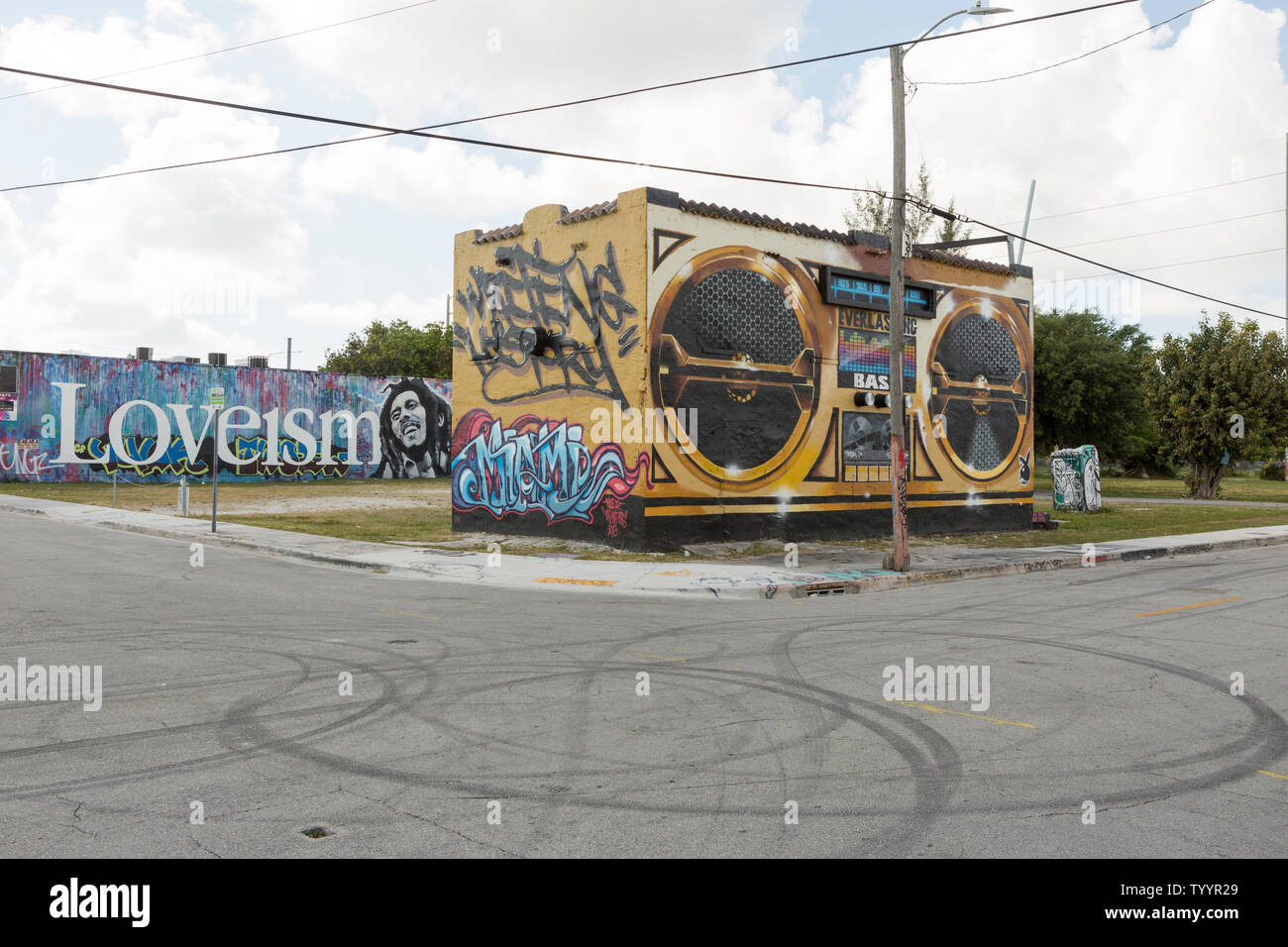 Graffiti depicting Bob Marley and a boom box on the walls of commercial ...