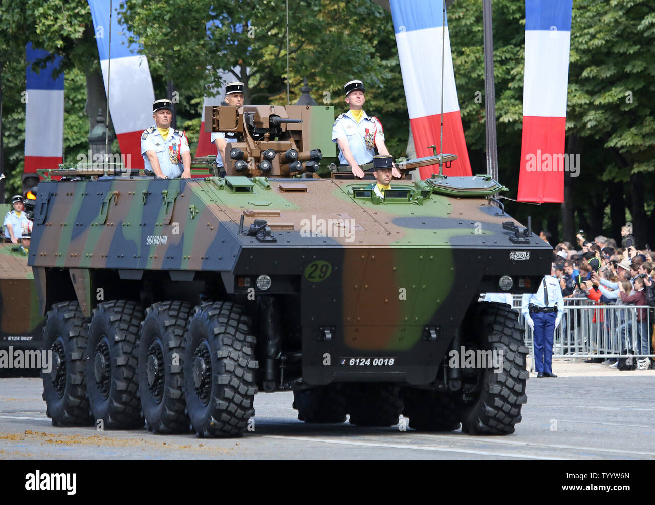 A French armored vehicle drives along Avenue des Champs-Elysees during ...