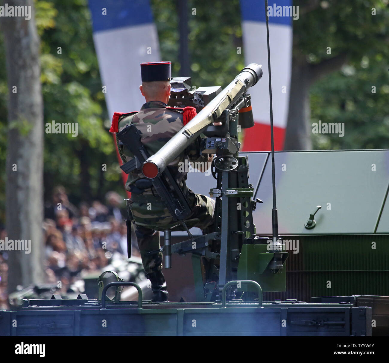 A French soldier rides on a rocket launcher vehicle along Avenue des ...