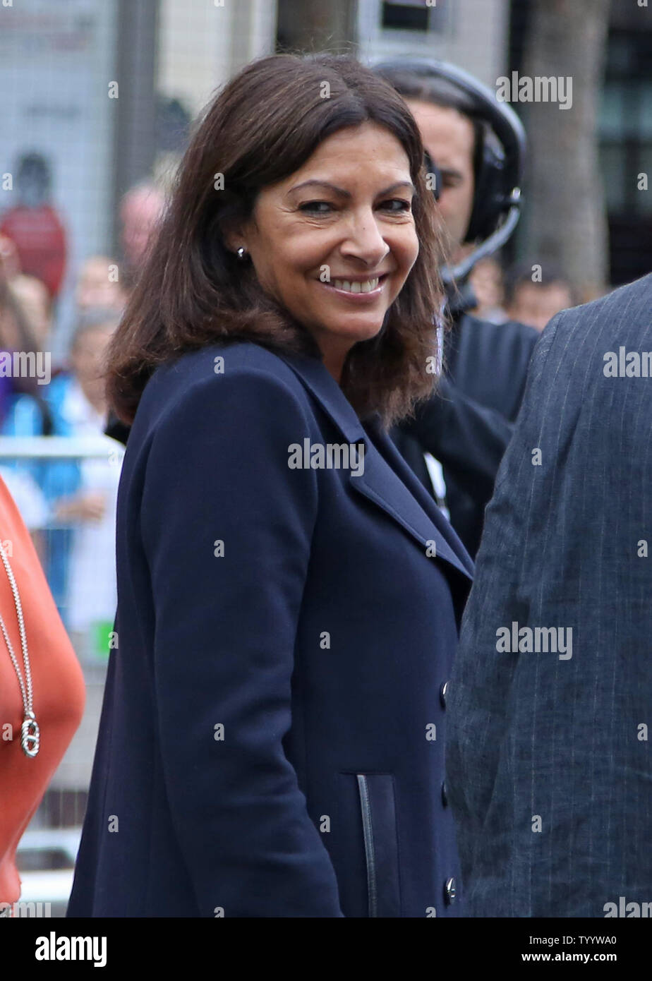 Paris Mayor Anne Hidalgo arrives on the Avenue des Champs-Elysees ...