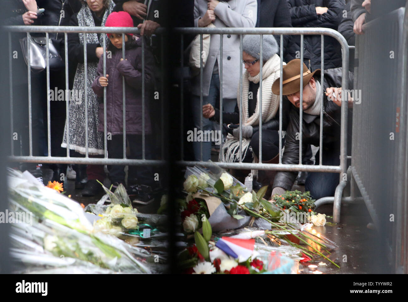 People pay tribute to victims of a terror attack in front of the ...