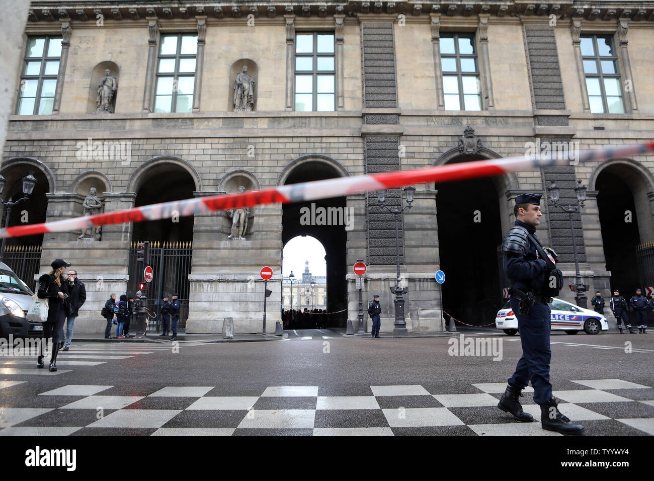 Security forces keep vigil in front of the Louvre Museum in Paris ...