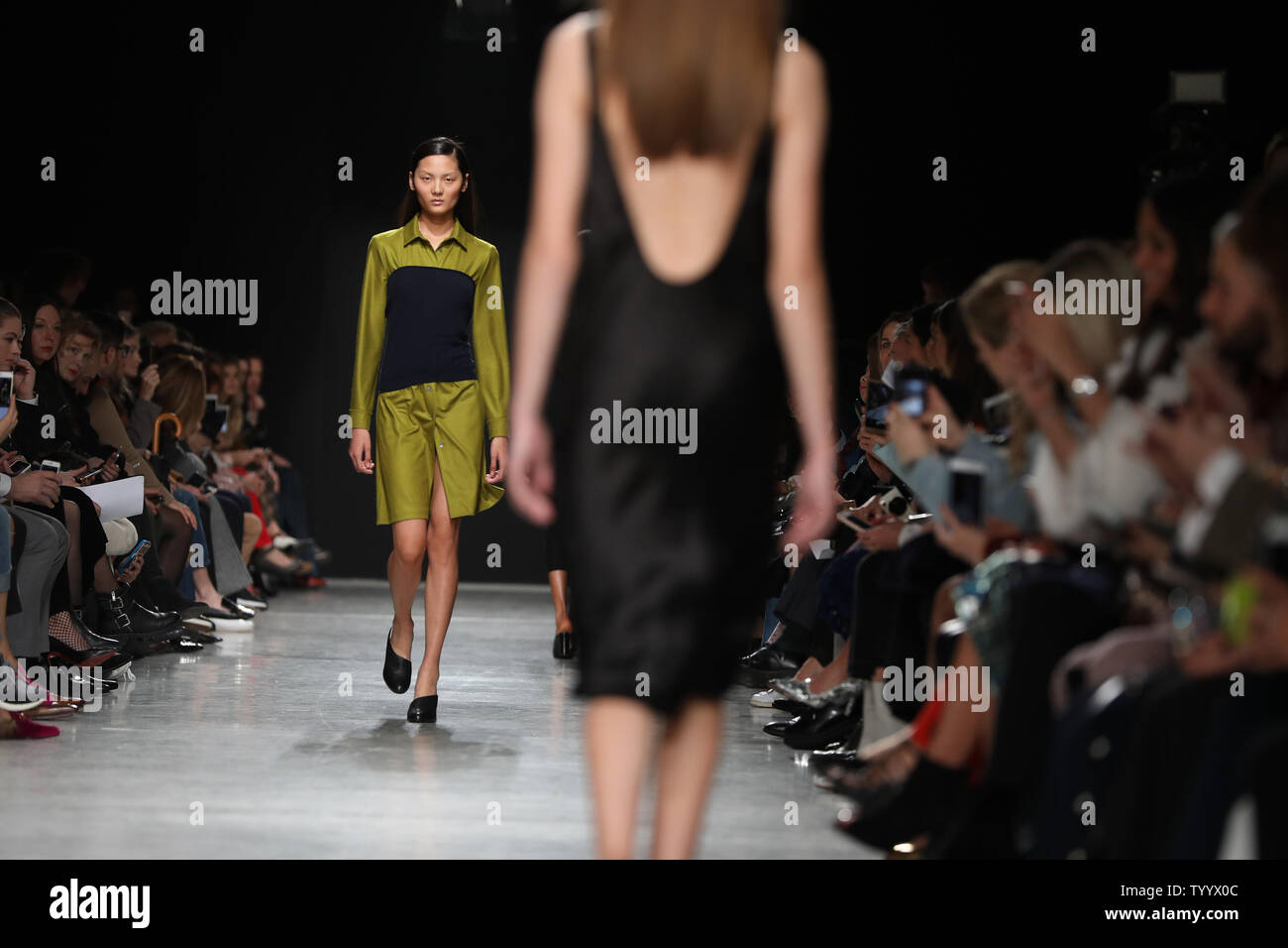 A model takes to the catwalk during the presentation of Guy Laroche ...