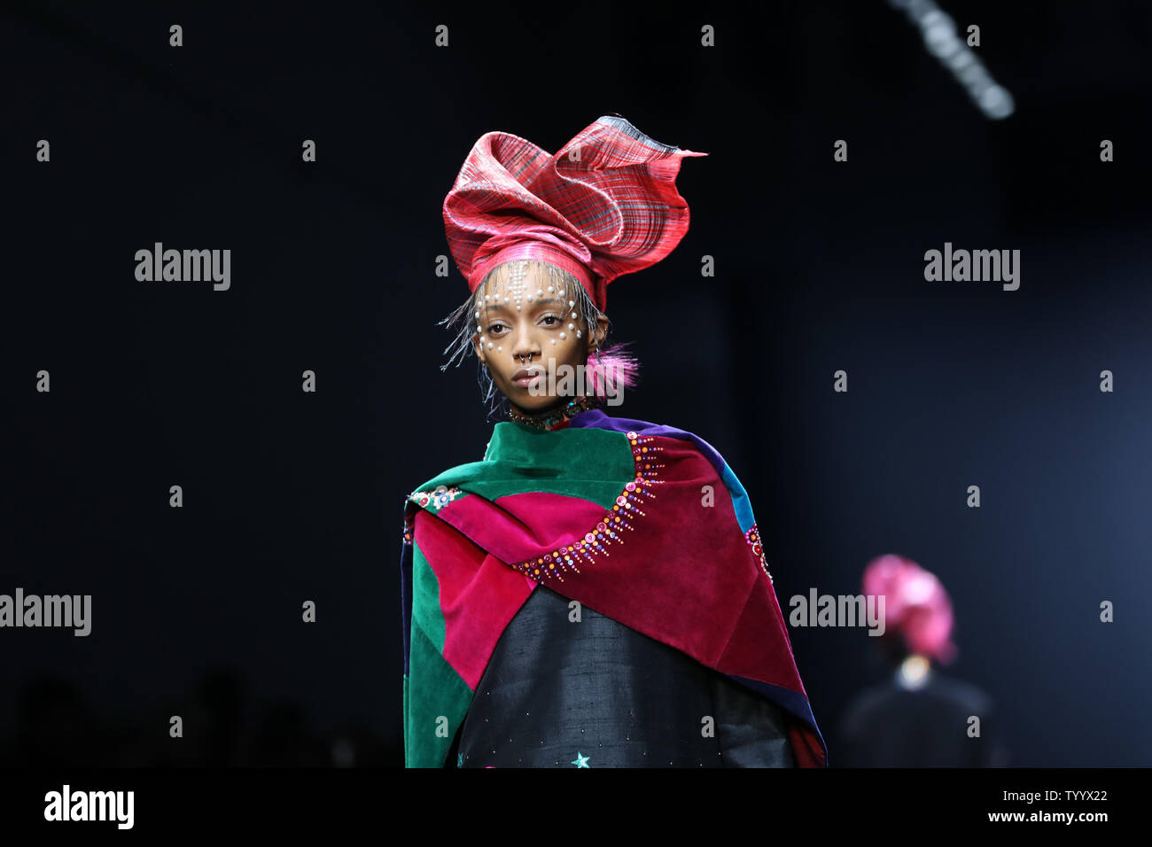 A model takes to the catwalk during the presentation of Manish Arora's ...