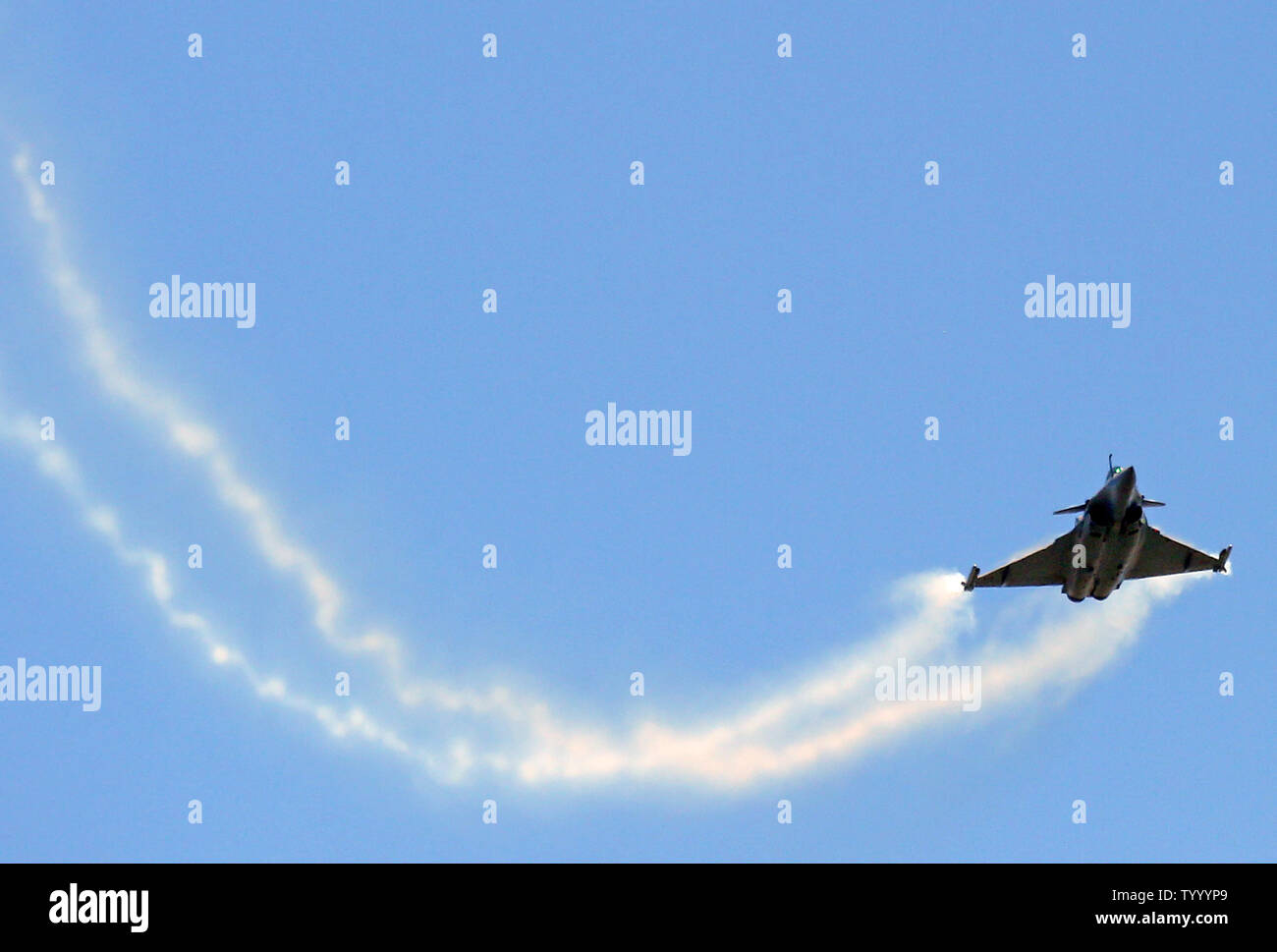 A Dassault Rafale fighter aircraft takes to the sky during the opening ...