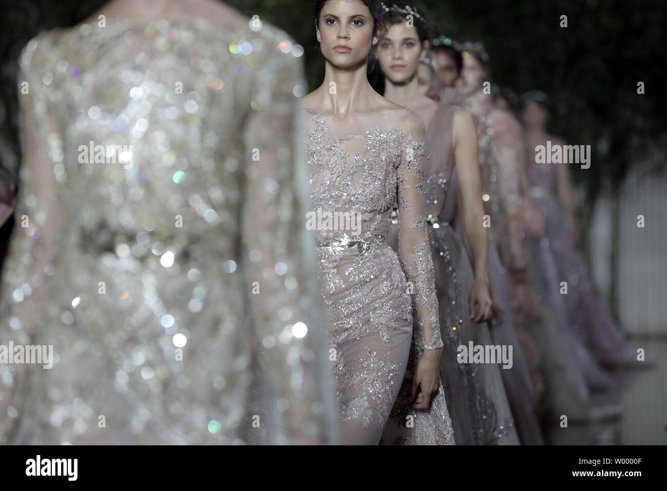 Models line up at the end of the presentation of Zuhair Murad's show as ...
