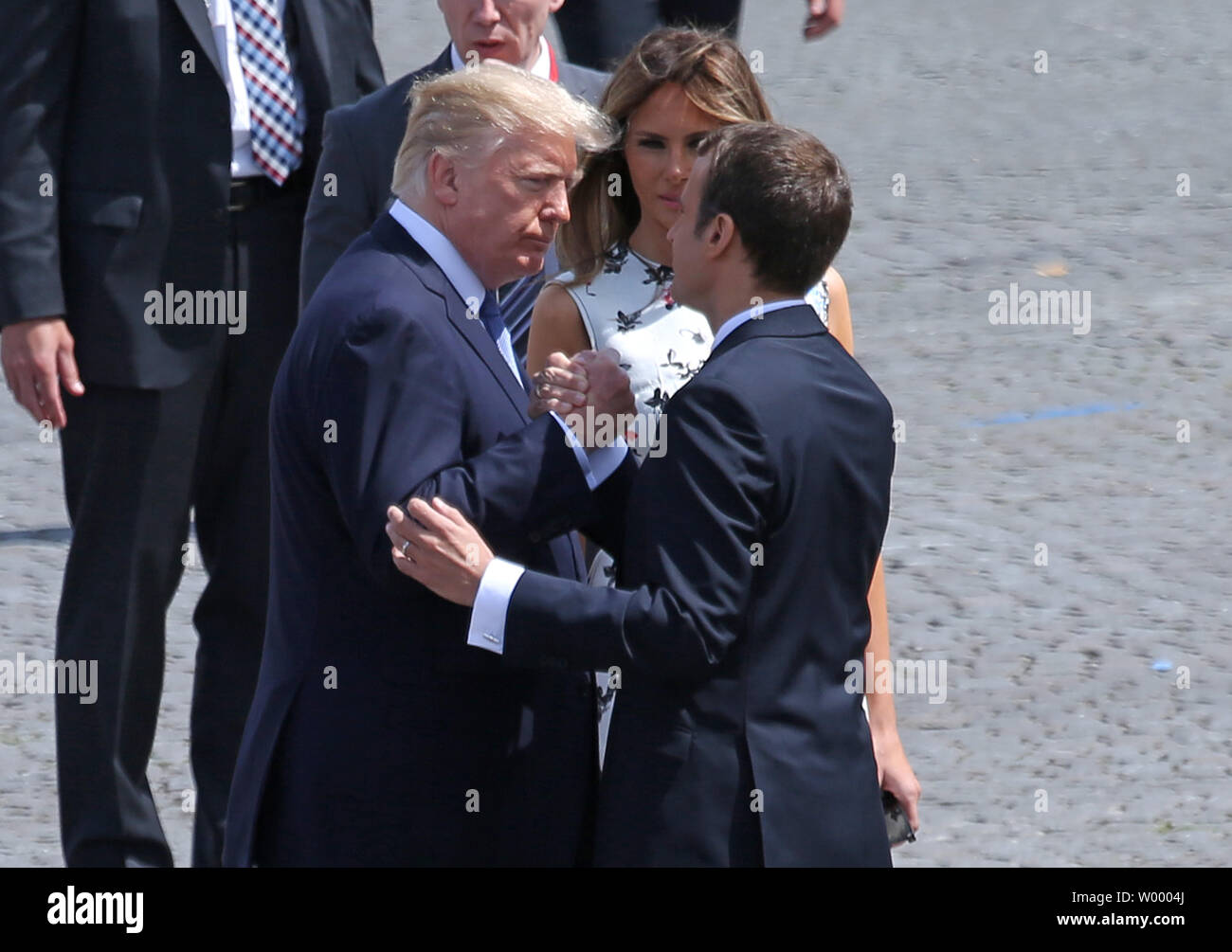 U.S. President Donald Trump (L) says goodbye to French President ...