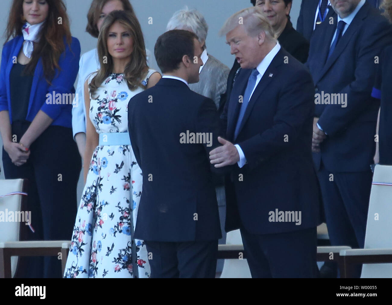 U.S. First Lady Melania Trump (L), French President Emmanuel Macron (C ...