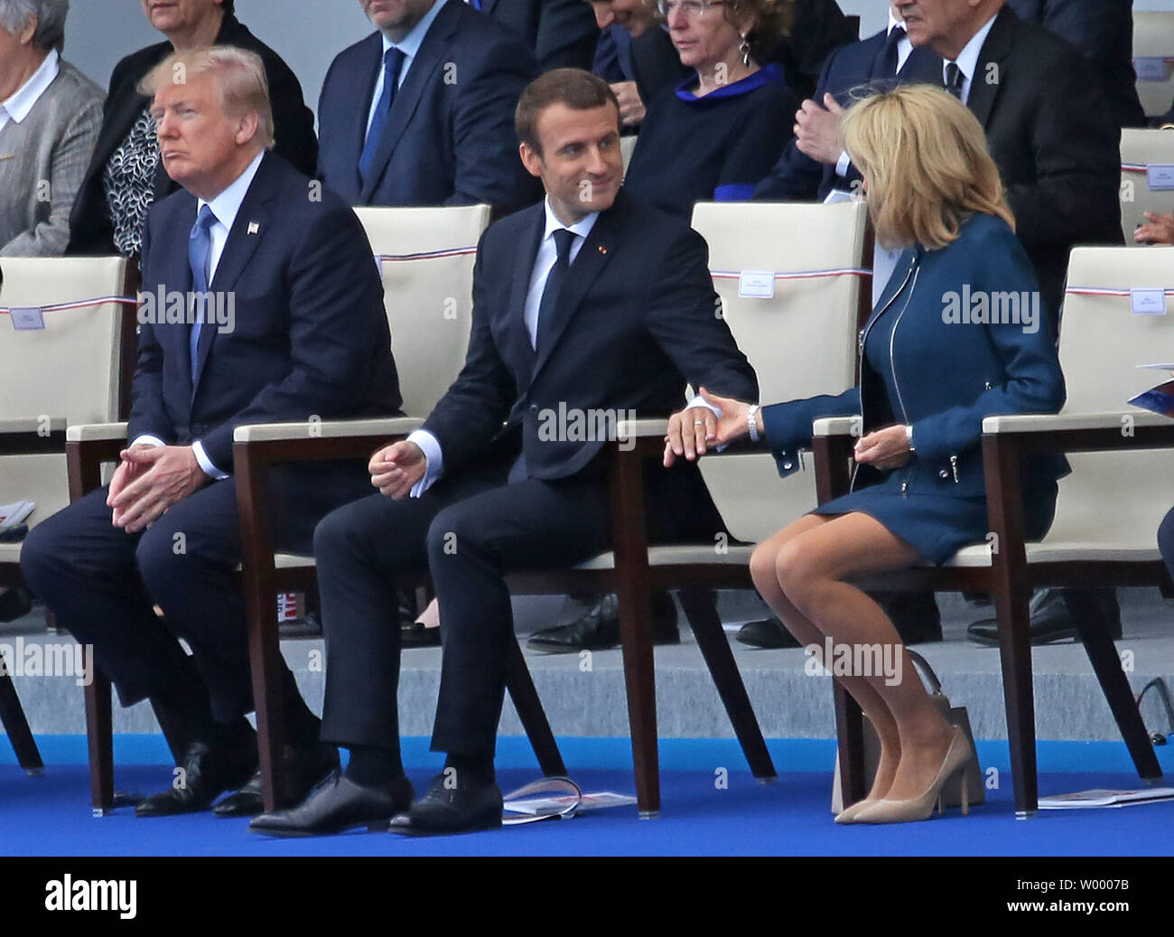 U.S. President Donald Trump (L), French President Emmanuel Macron (C ...