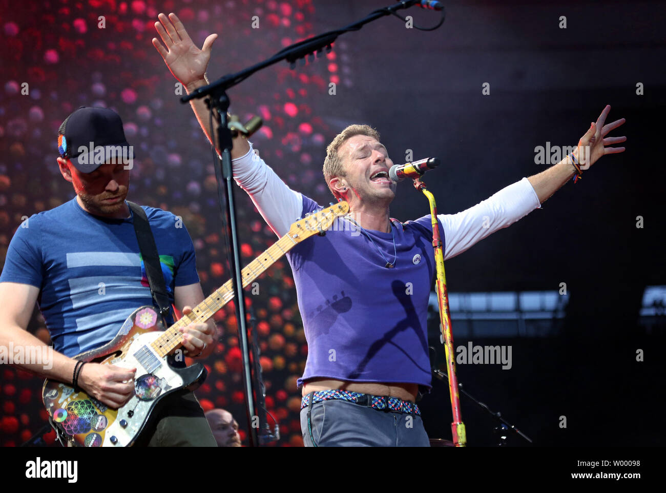 Will Champion (L) and Chris Martin of Coldplay perform in concert at ...