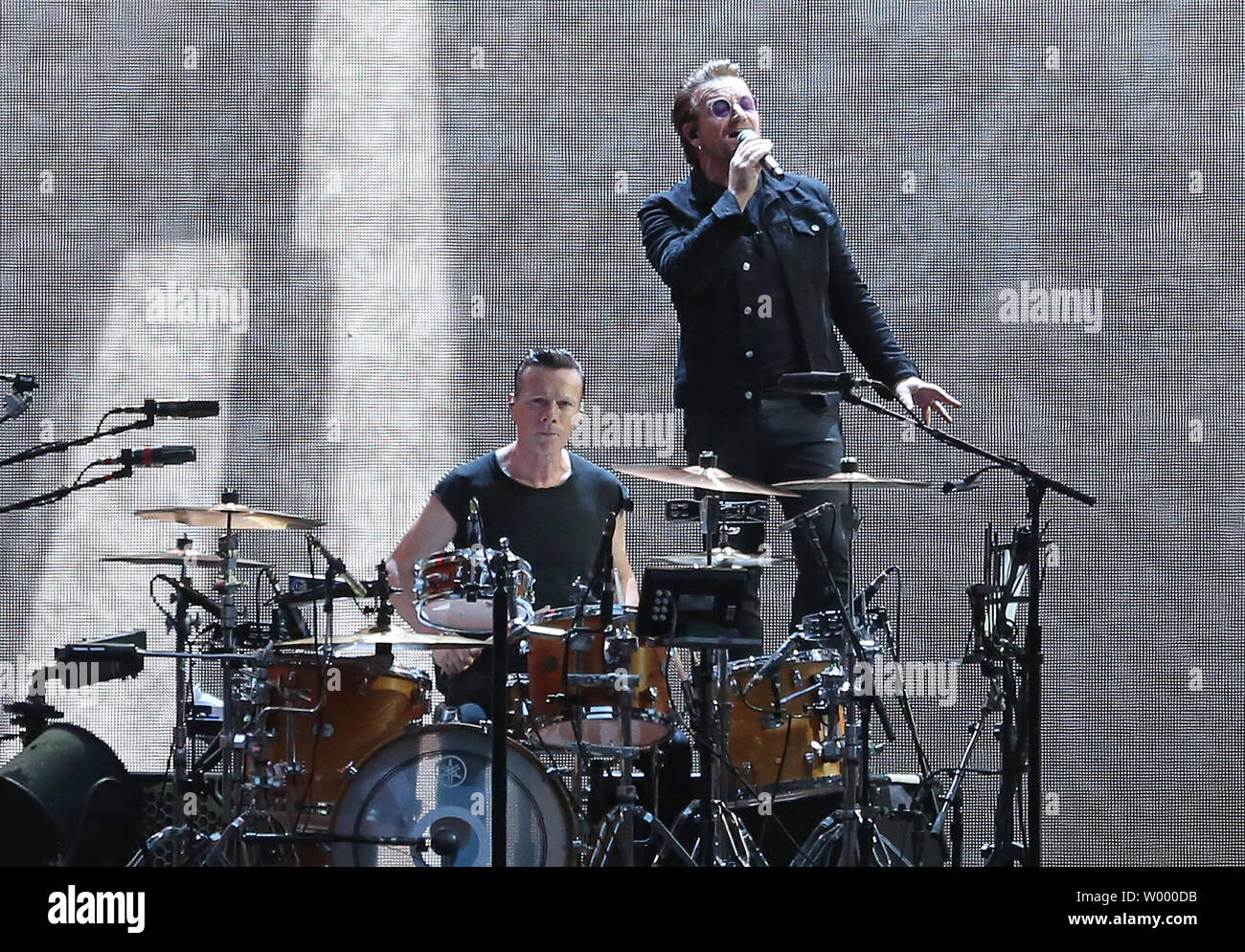 Larry Mullen Jr (L) and Bono of the band U2 perform in concert at the ...