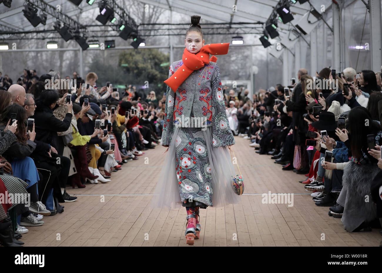 A model takes to the catwalk during the presentation of Manish Arora's ...