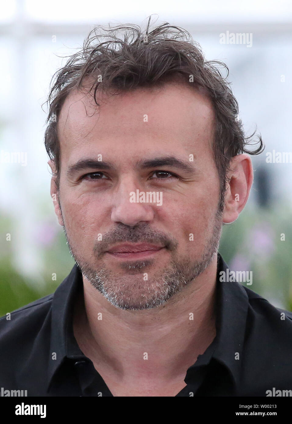 Stephane Rideau arrives at a photocall for the film "Gueule d'ange ...