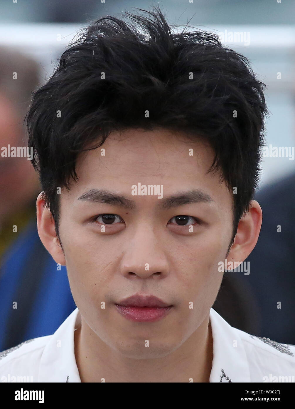 Huang Jue arrives at a photocall for the film "Long Day's Journey Into ...